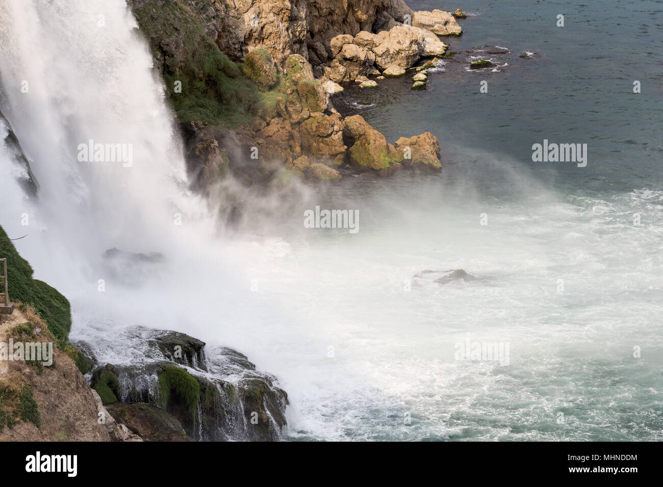 Horizontal landscape with beautiful waterfall falling into the sea ...