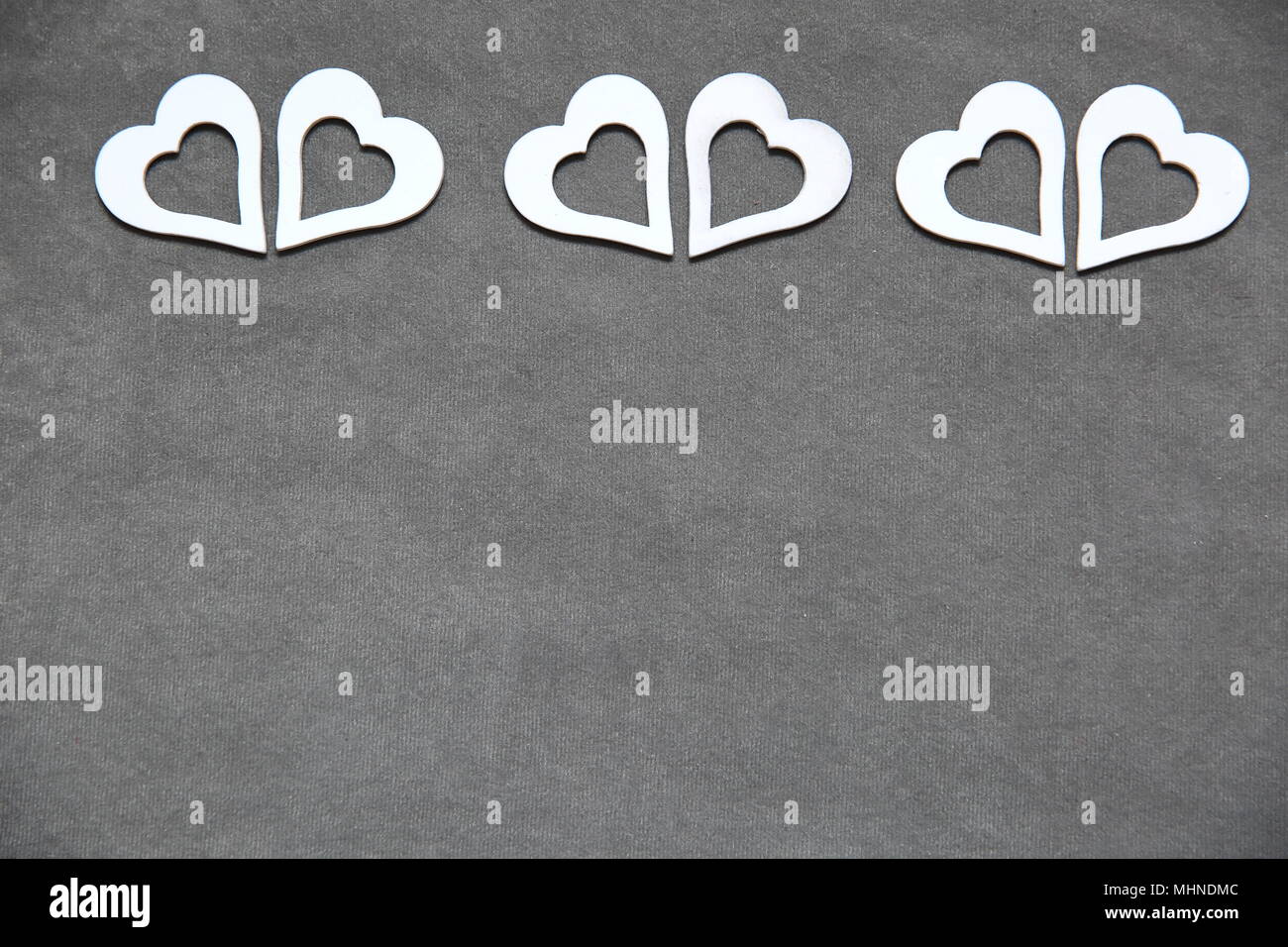 White clean heart on a gray background for all lovers Stock Photo - Alamy