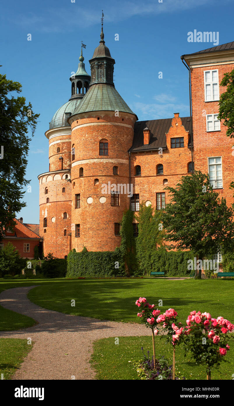 Part of Gripsholm Castle with a tower and park in Mariefred, Sweden ...