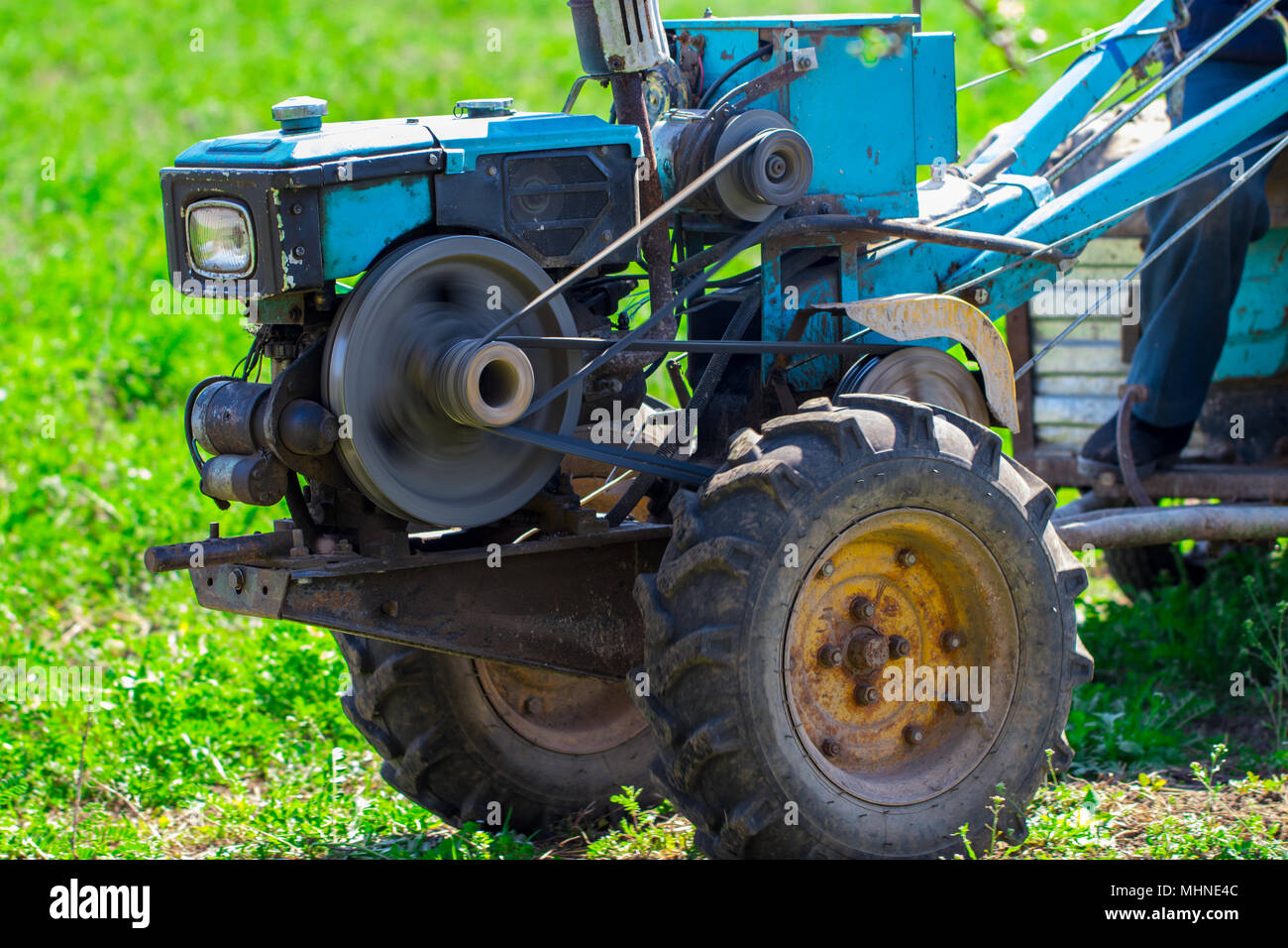 Motoblock plows soil in the farm summer Stock Photo - Alamy