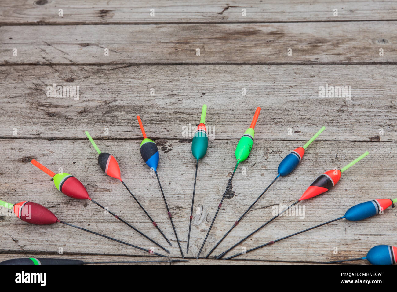 Fishing floats on a wooden background. Floats the fishing different on ...