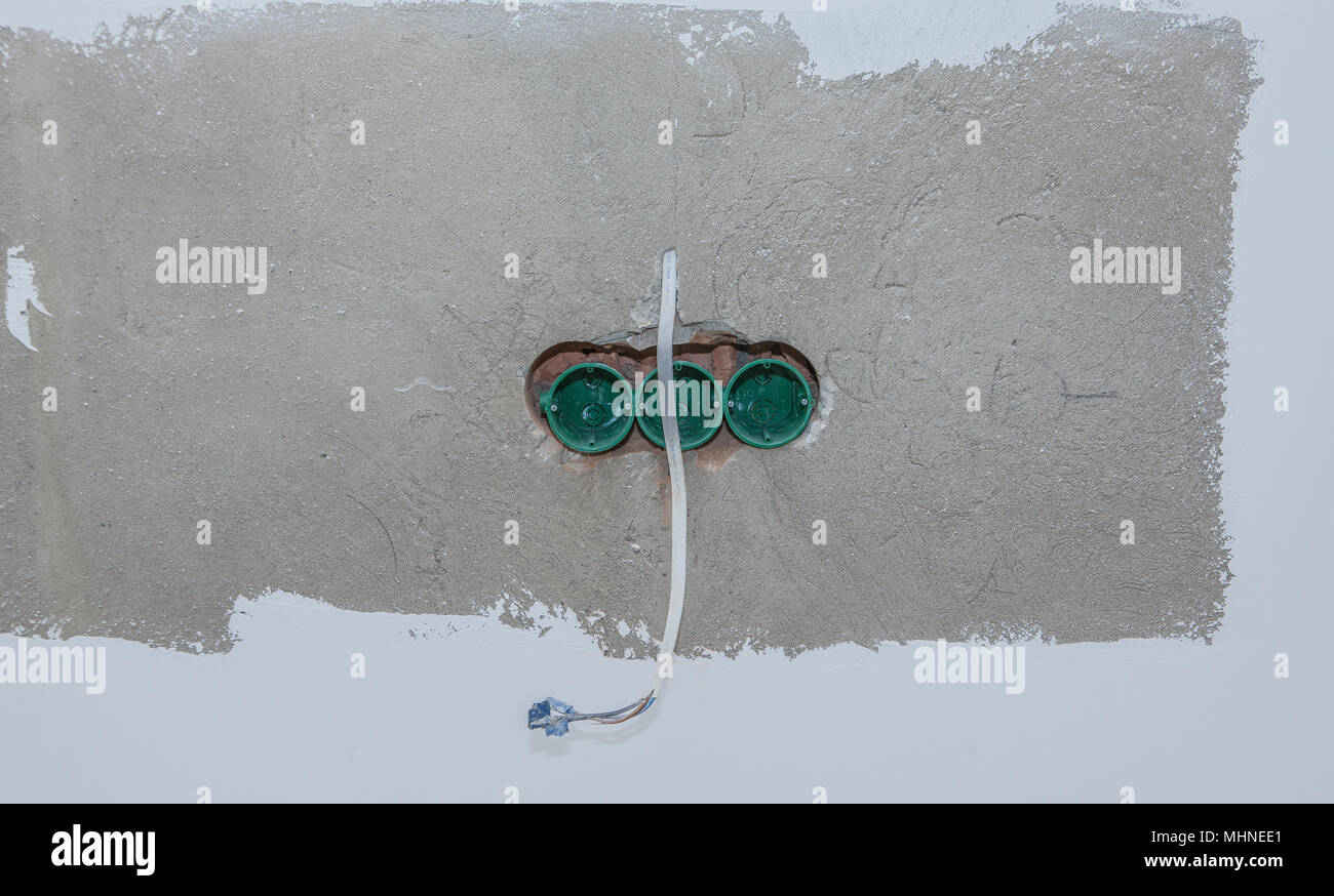 Prepared place for setting of wall outlet Stock Photo - Alamy