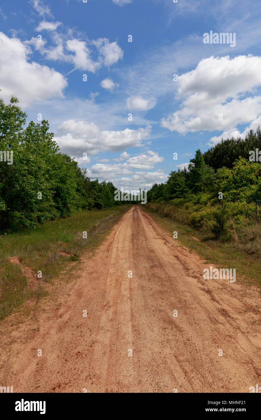 Country Red Dirt Road Blue Sky Clouds Stock Photo - Alamy