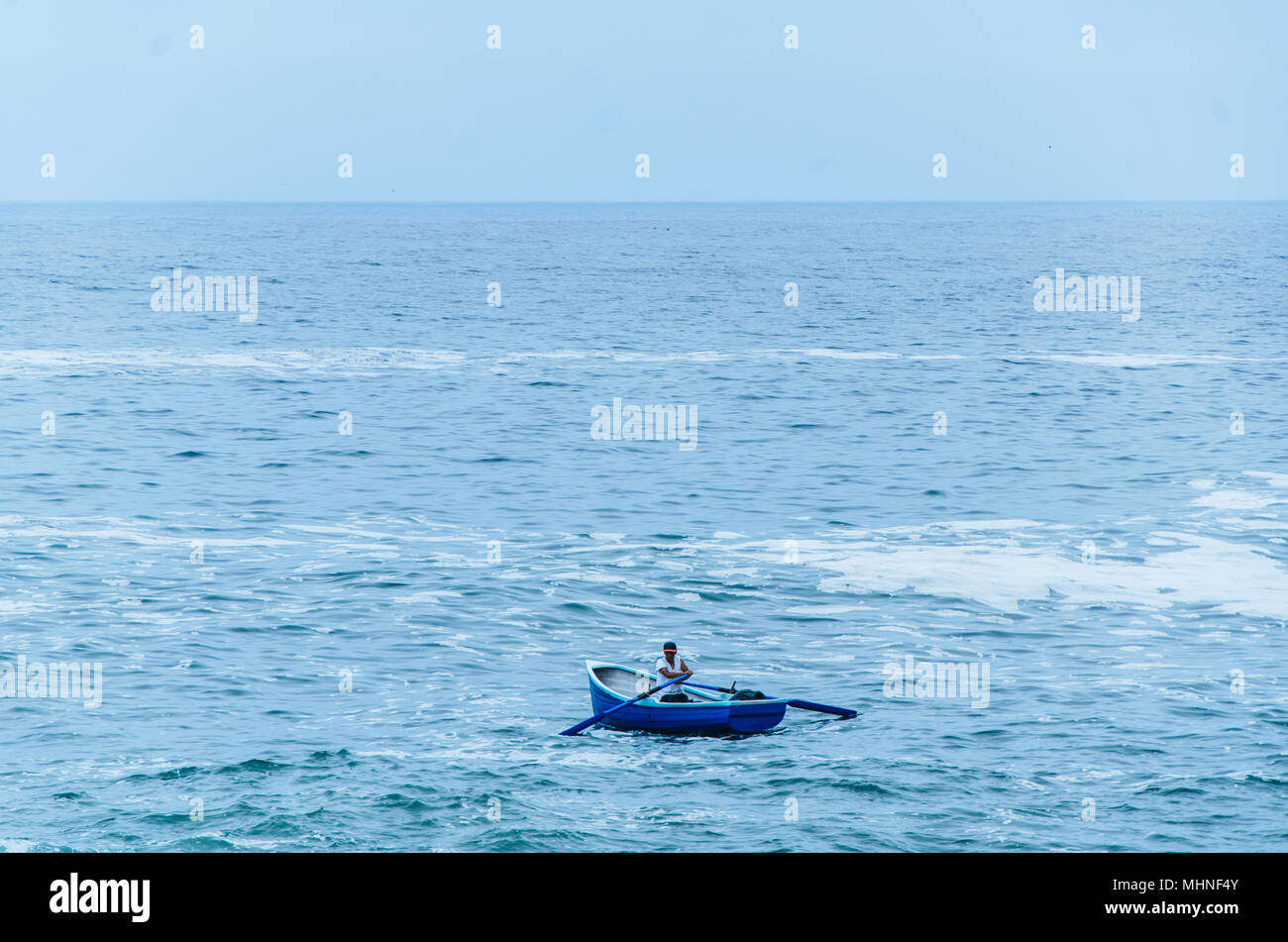 Boatman sailing on the beaches of Lima - Peru Stock Photo - Alamy