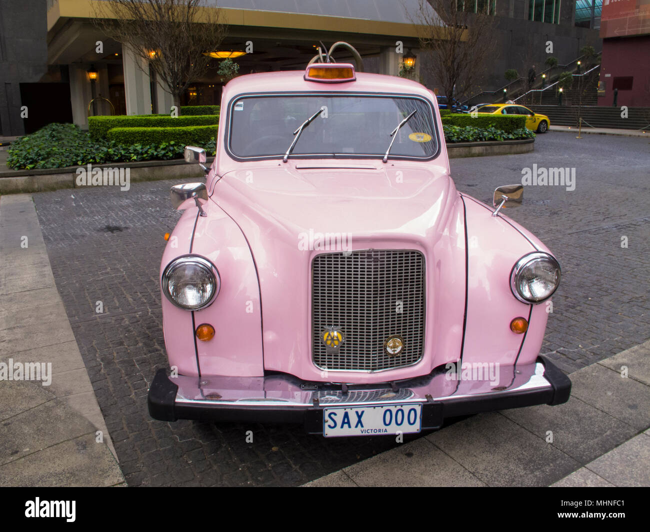 Pink taxi in a private carpark Stock Photo - Alamy
