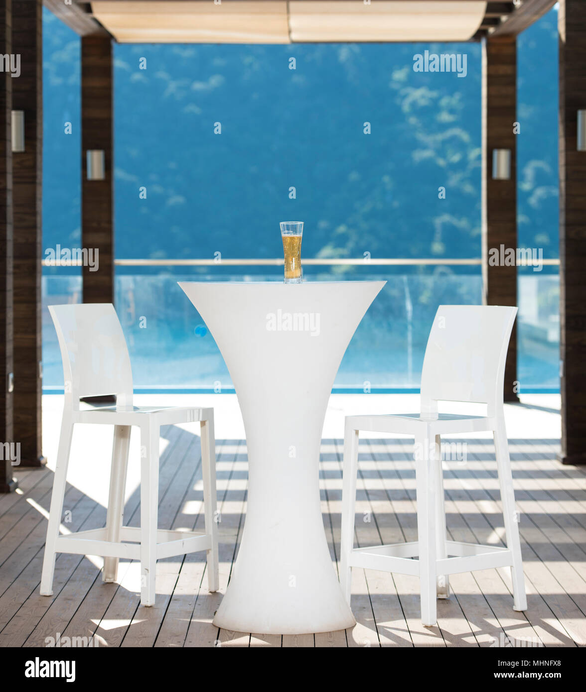 Terrace bar table and chairs Stock Photo - Alamy