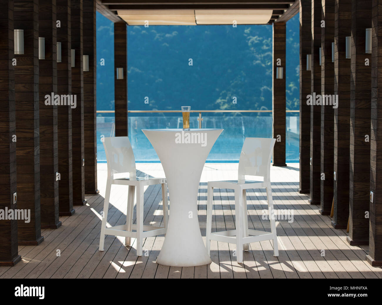 Terrace bar table and chairs Stock Photo - Alamy