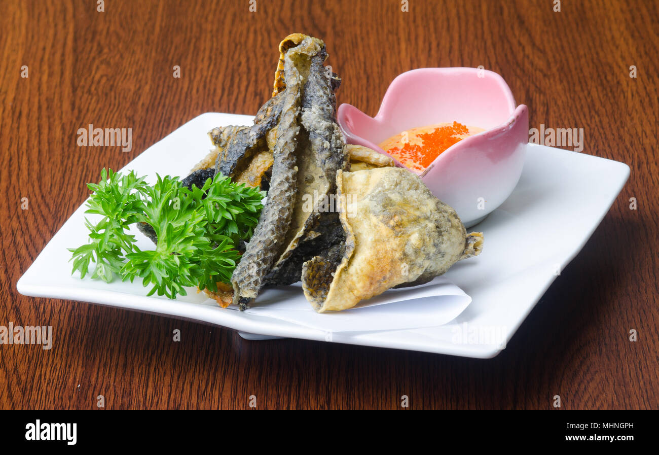 japanese cuisine. fried fish skin on background Stock Photo - Alamy