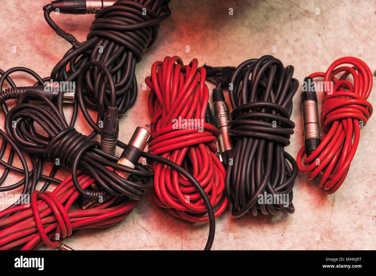 Audio cables for musical instruments and microphones on the floor Stock ...
