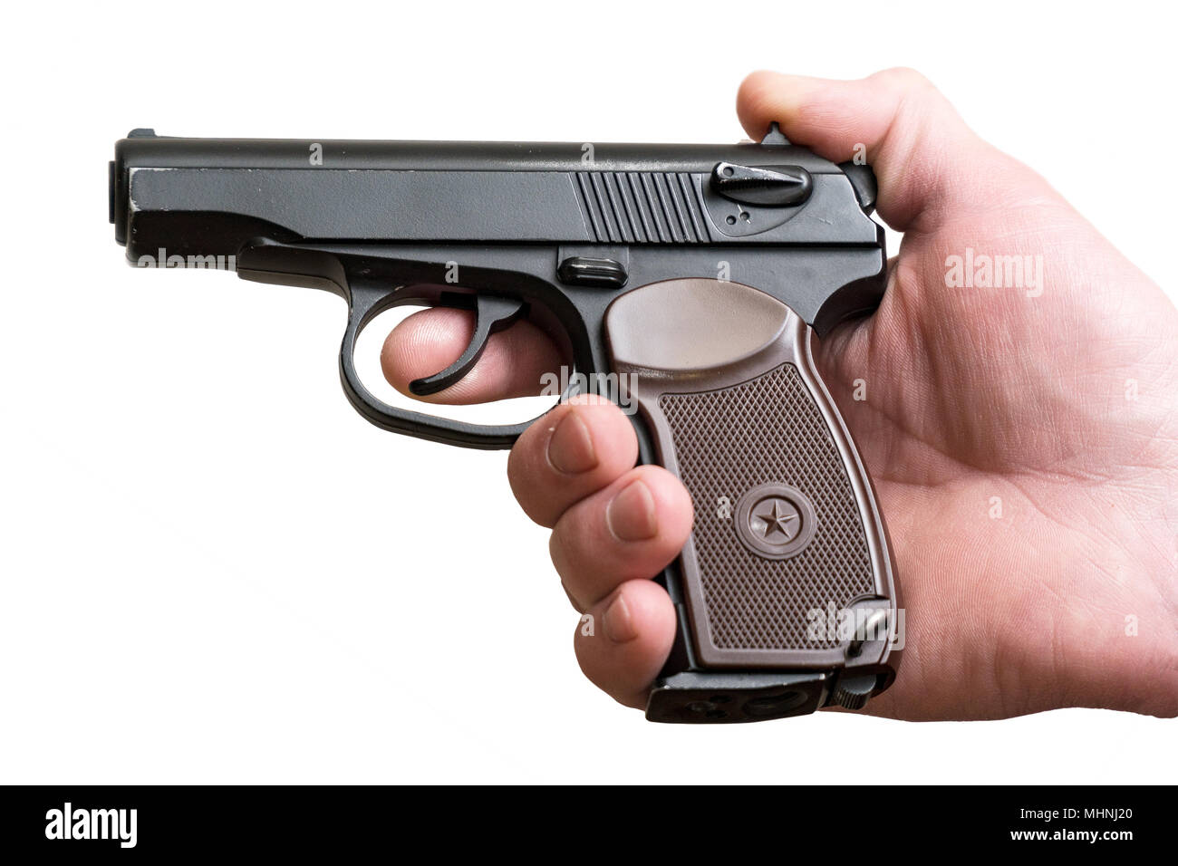 Pistol in the hands of a man isolated Stock Photo - Alamy