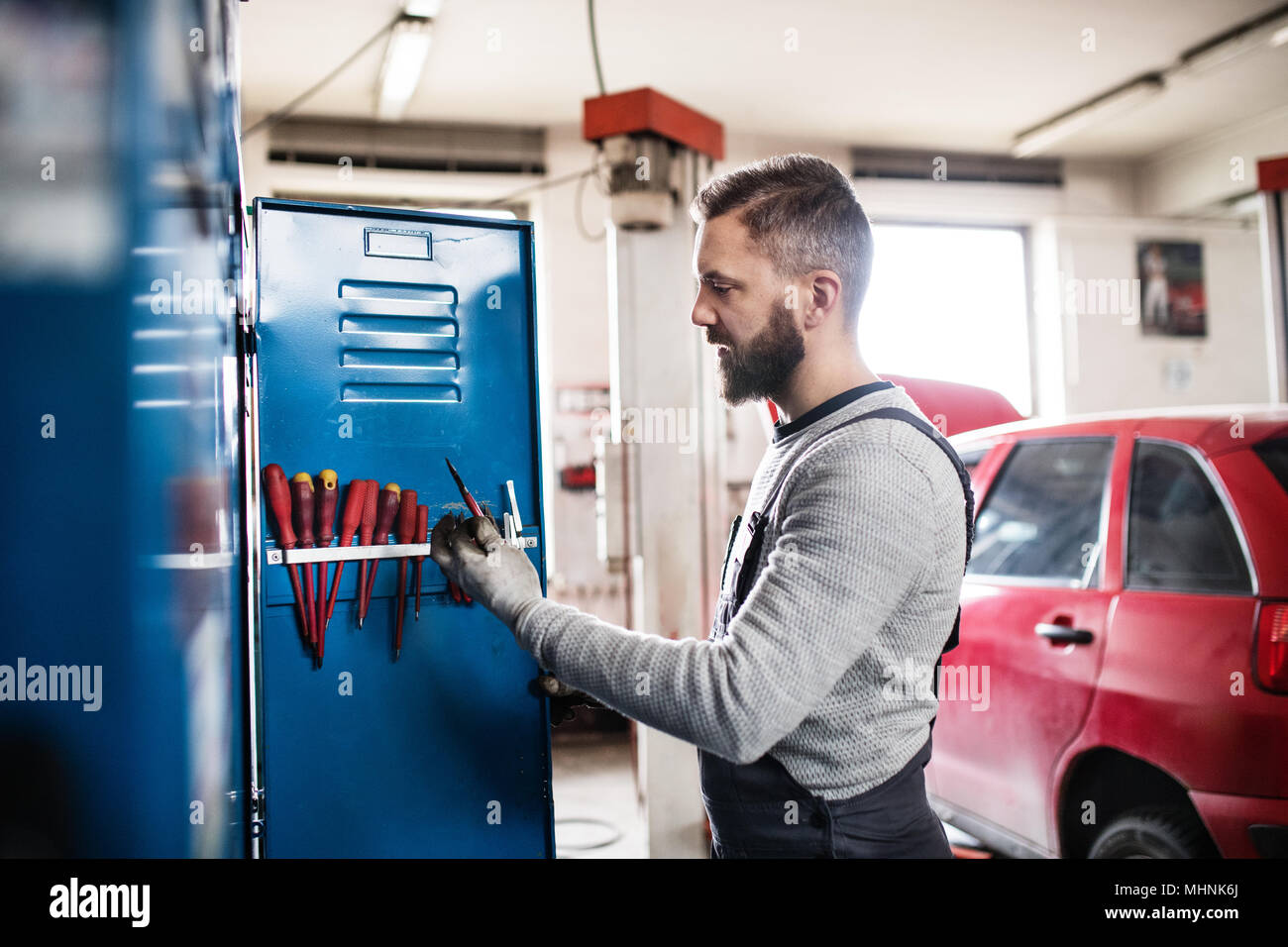Mechanic standing in garage hi-res stock photography and images - Alamy