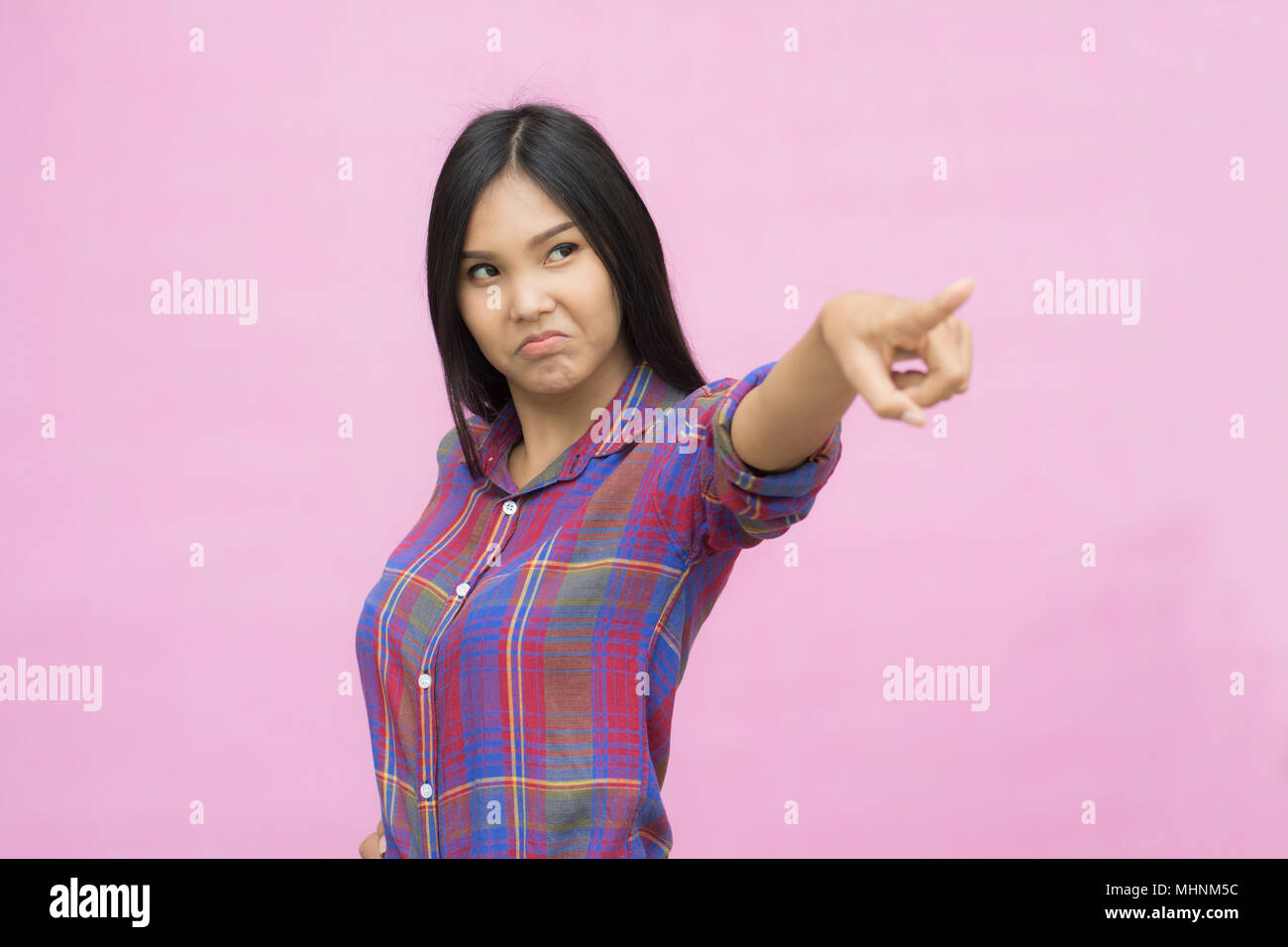 Portrait of young asian girl pout and pointing, Stubborn teenage girl ...