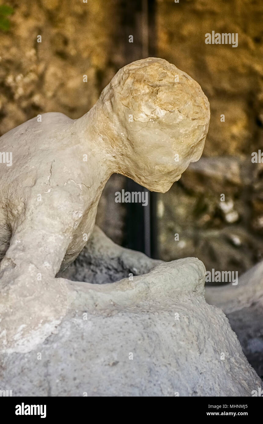 some plaster casts of victim of the eruption still in actual pompeii ...