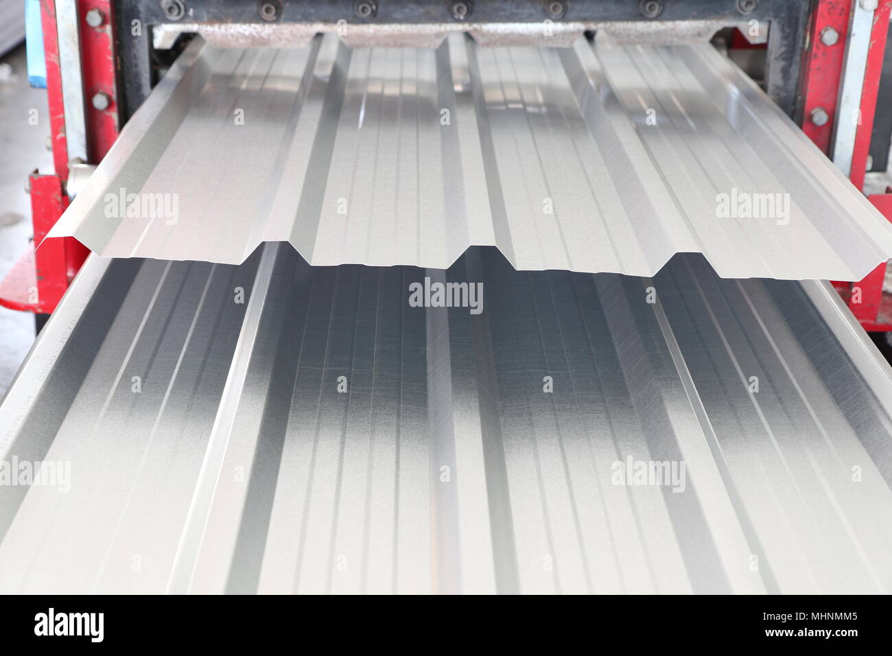 metal sheet roof rolled from rolling machine ; close up Stock Photo - Alamy