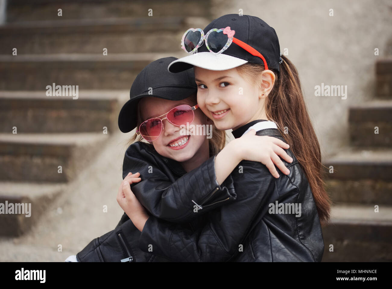 stylish funny little girls on the street Stock Photo - Alamy