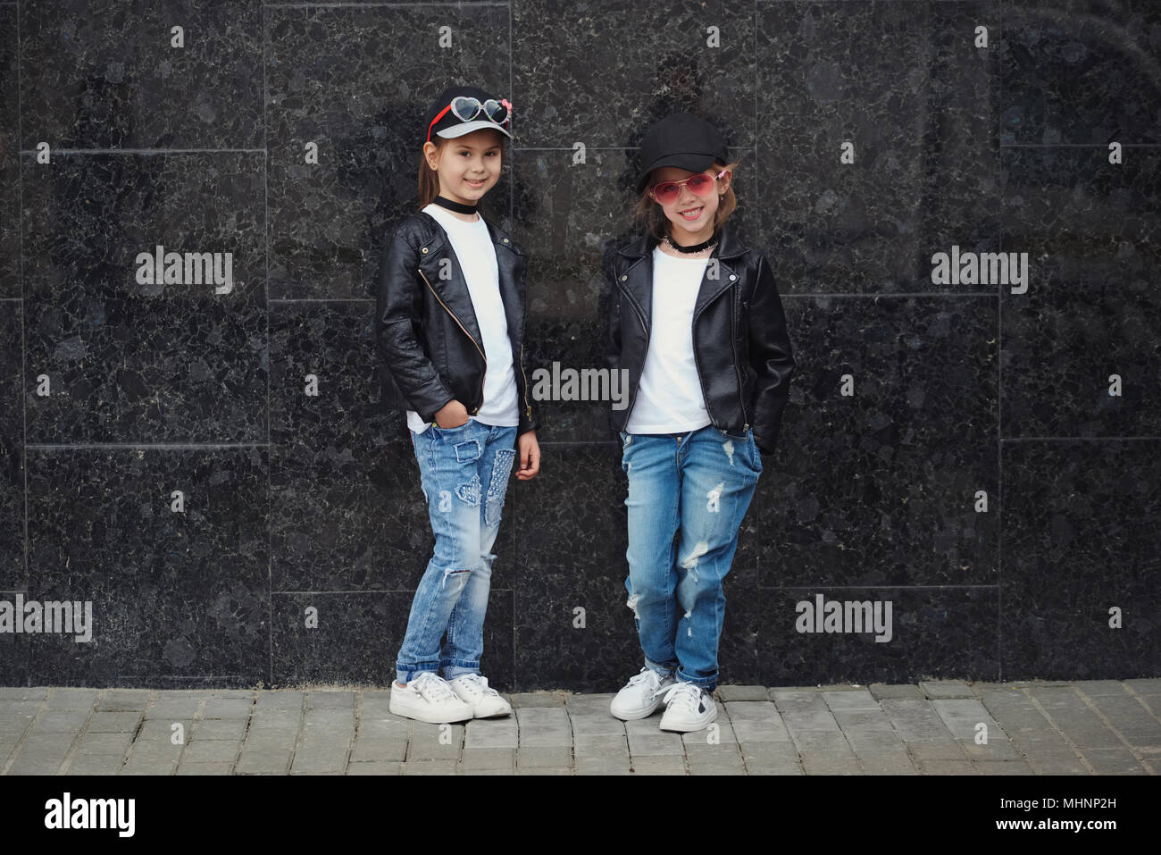 stylish funny little girls on the street Stock Photo - Alamy
