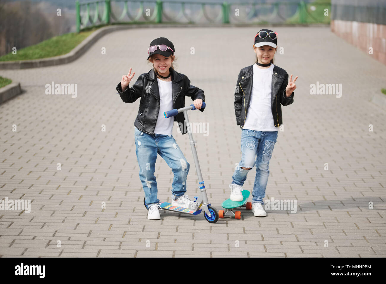 stylish funny little girls on the street Stock Photo - Alamy
