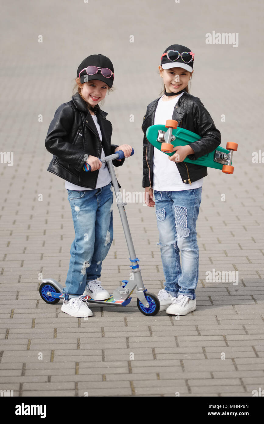 stylish funny little girls on the street Stock Photo - Alamy