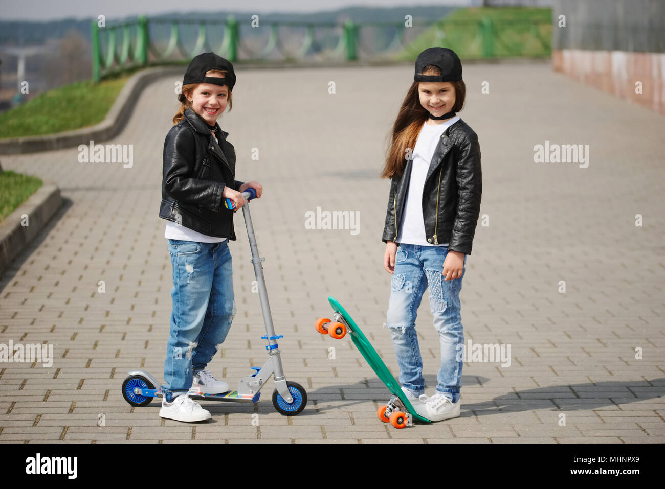 stylish funny little girls on the street Stock Photo - Alamy