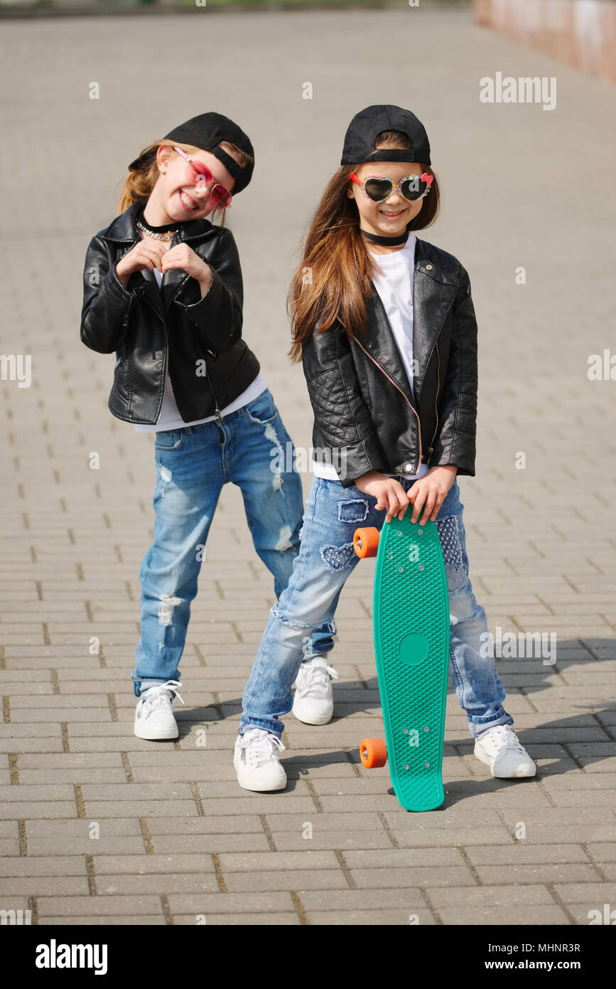 stylish funny little girls on the street Stock Photo - Alamy