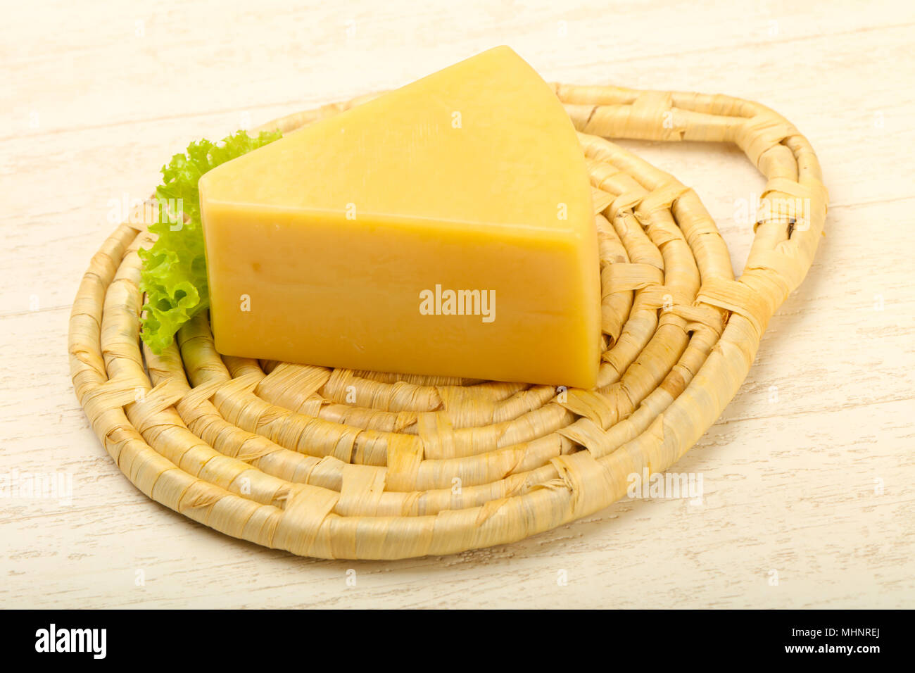 Parmesan cheese triangle Stock Photo - Alamy