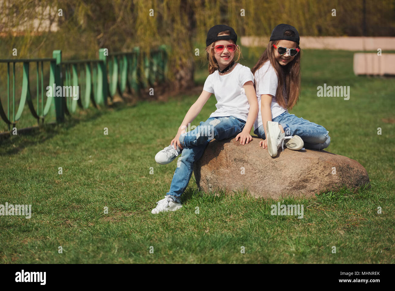 stylish funny little girls on the street Stock Photo - Alamy