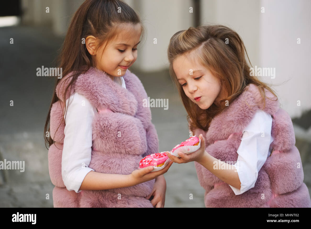 stylish funny little girls on the street Stock Photo - Alamy