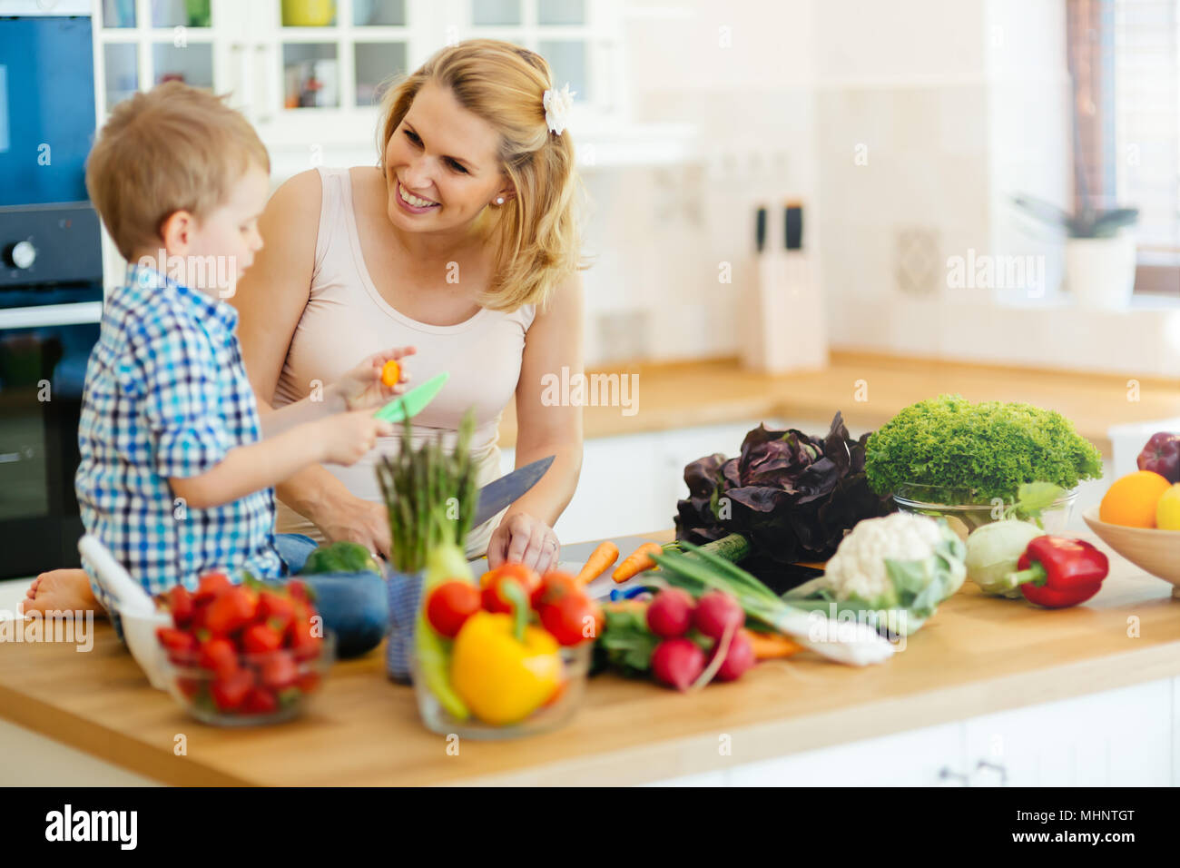 Mother and child preparing lunch Stock Photo - Alamy