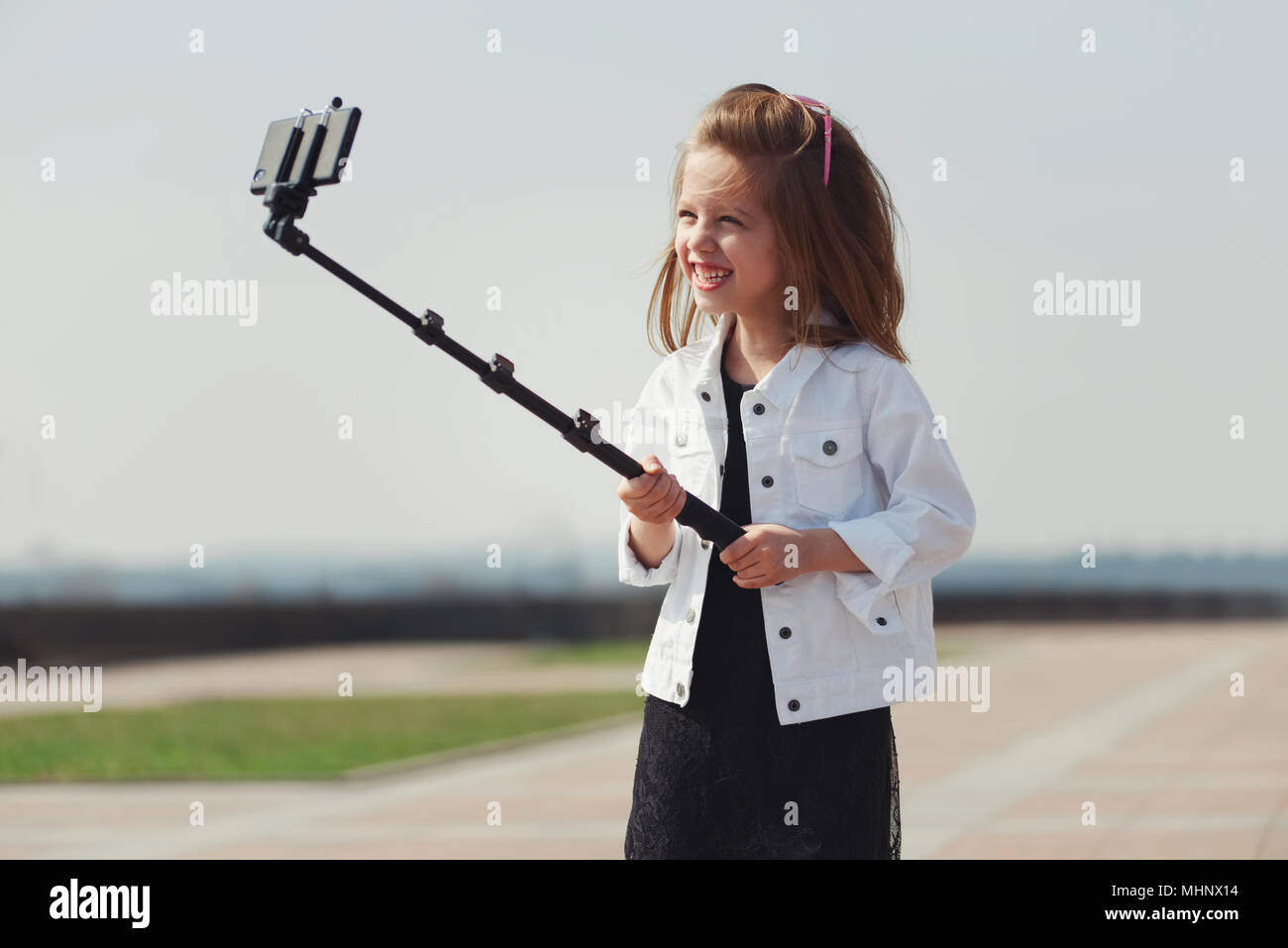 stylish funny little girl on the street Stock Photo - Alamy