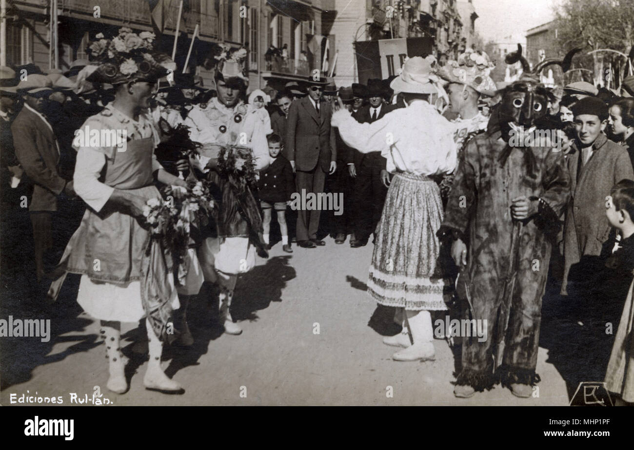 Spanish people in fancy dress in the street Stock Photo - Alamy