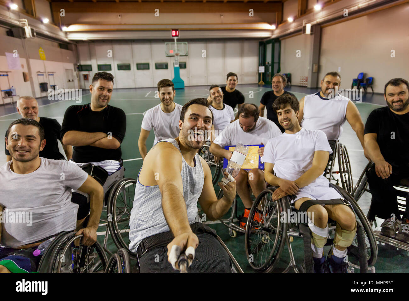 disabled sport men relaxation while playing indoor basketball at a ...