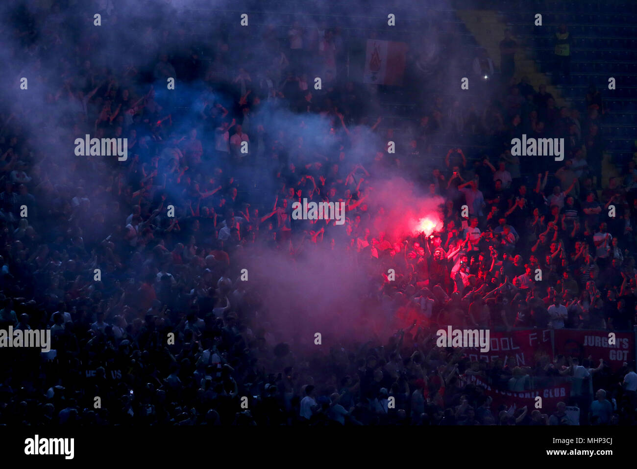 Liverpool fans light flares in the stands during the UEFA Champions ...