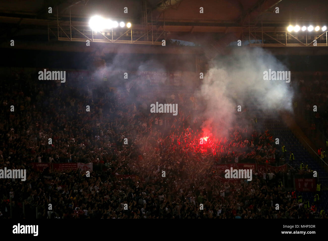Liverpool fans light flares in the stands during the UEFA Champions ...