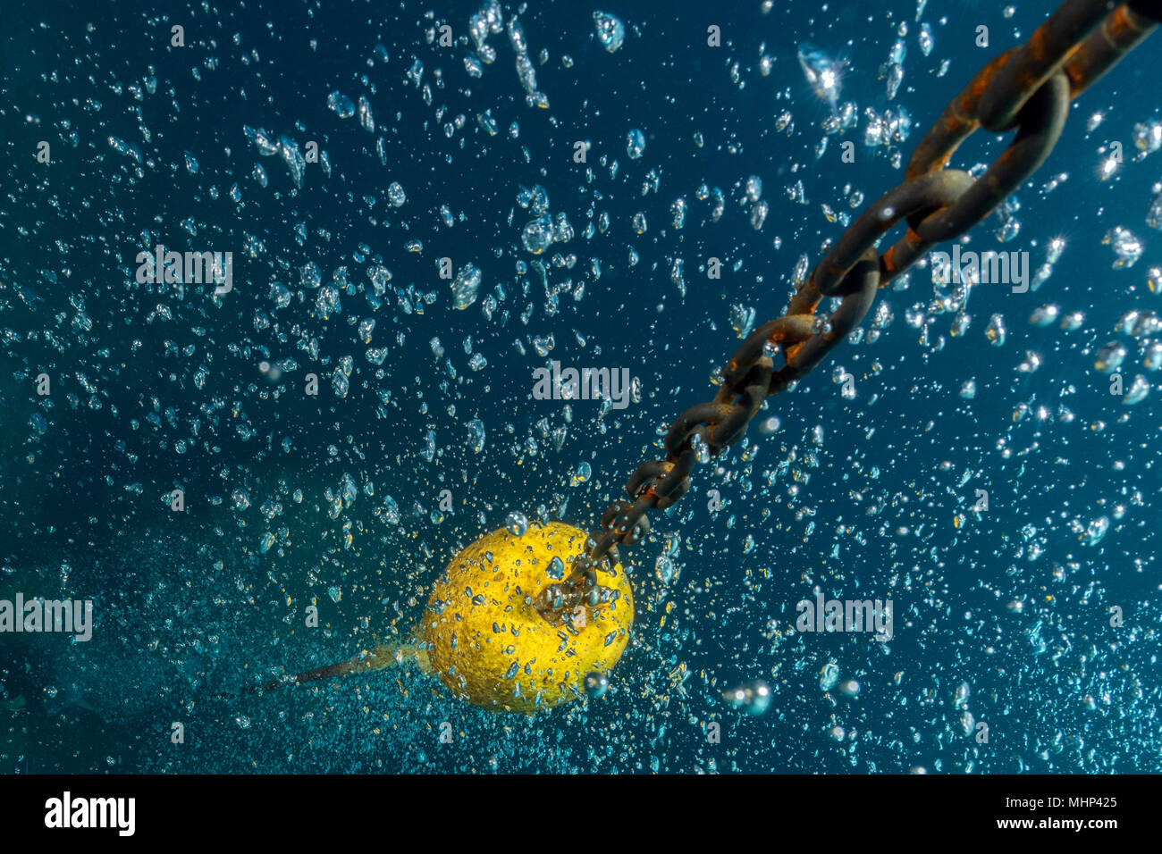 scuba diver bubbles coming from bottom to surface near ship chain Stock ...