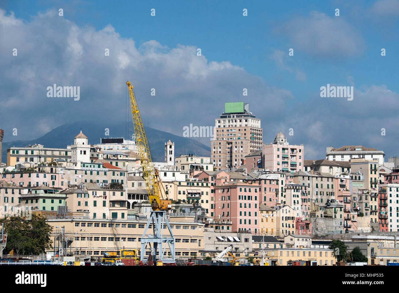 genoa town cityscape panorama from the sea harbor cranes and ferry on ...
