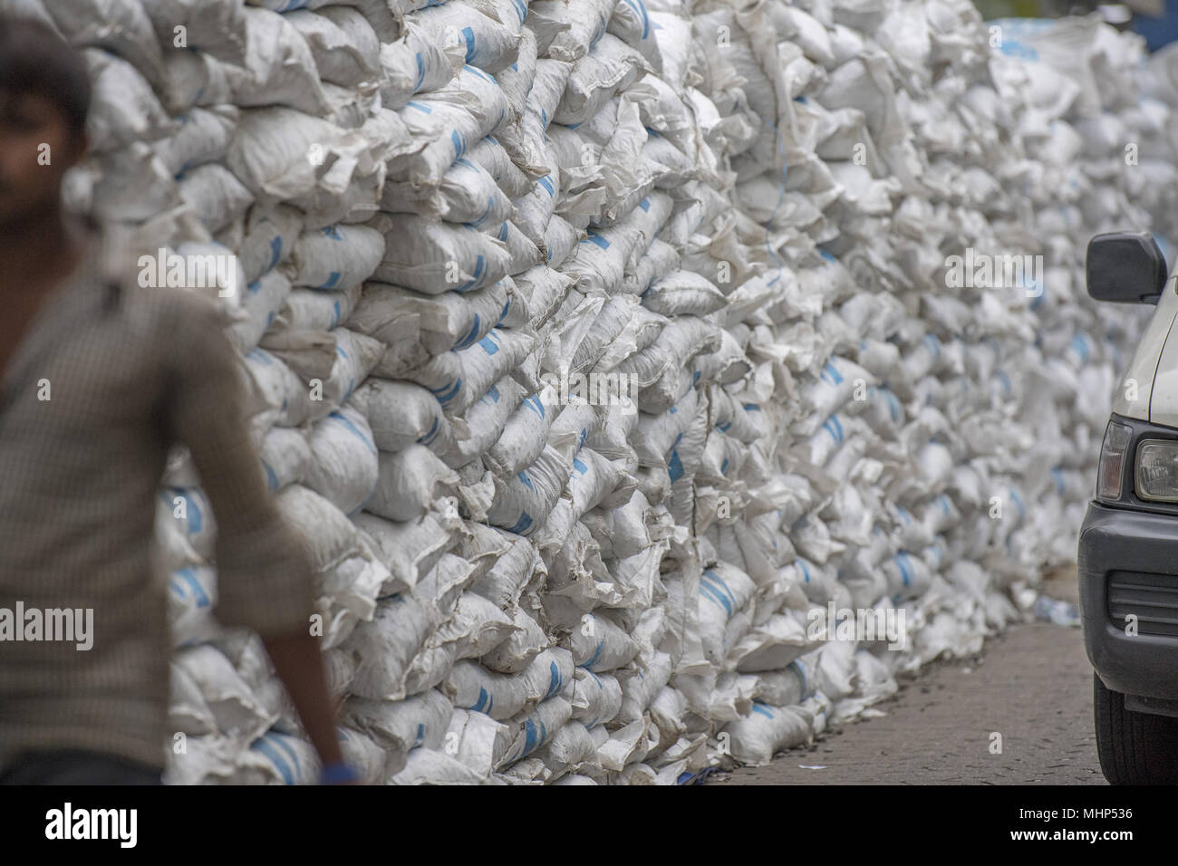 many Sacks of cement on the road Stock Photo - Alamy
