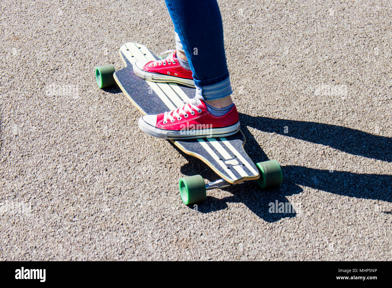 Brunette Girl Riding Penny Board