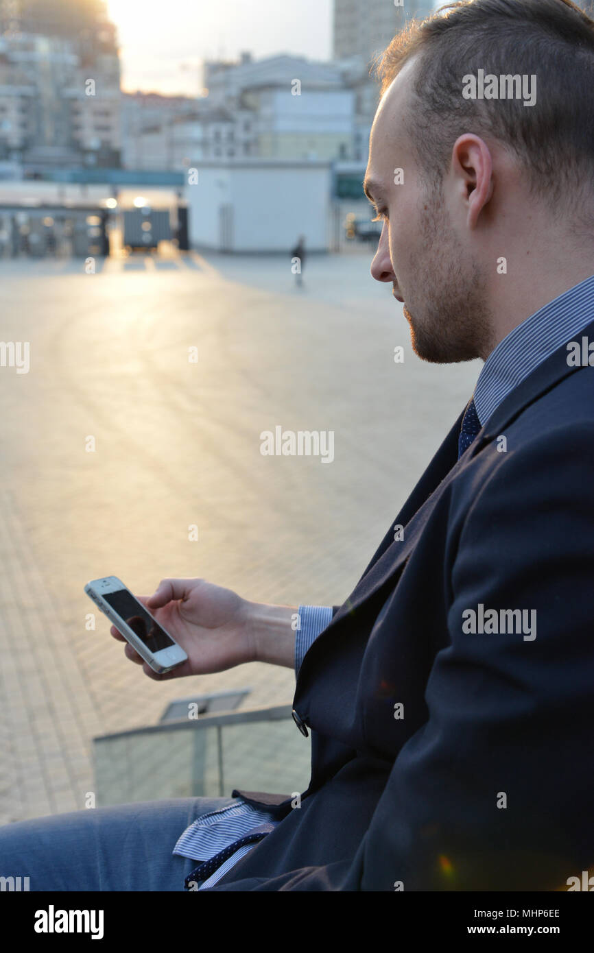 handsome businessman using smartphone Stock Photo - Alamy