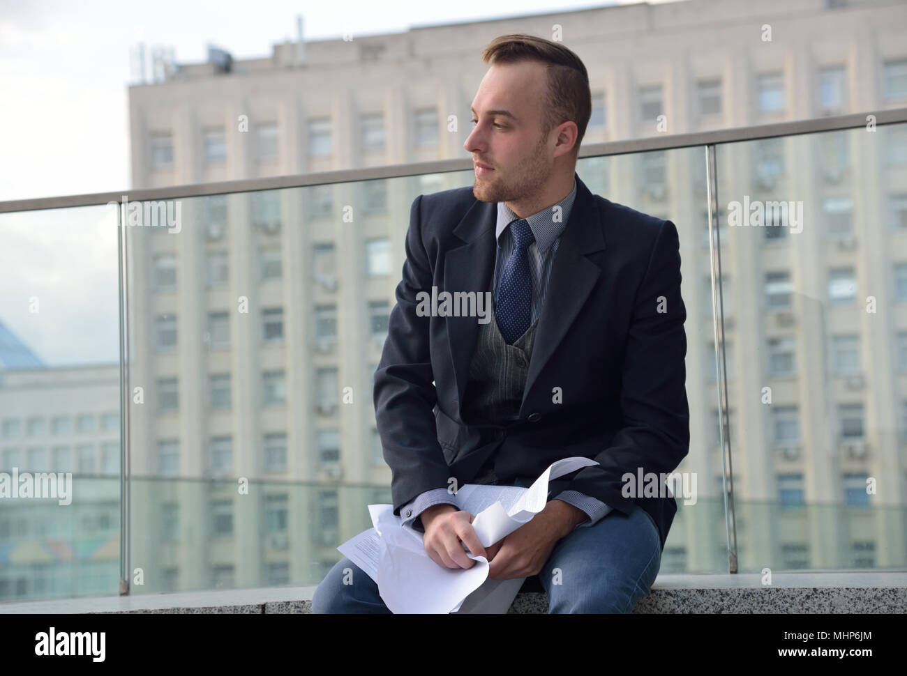 tired businessman reading paper documents Stock Photo - Alamy
