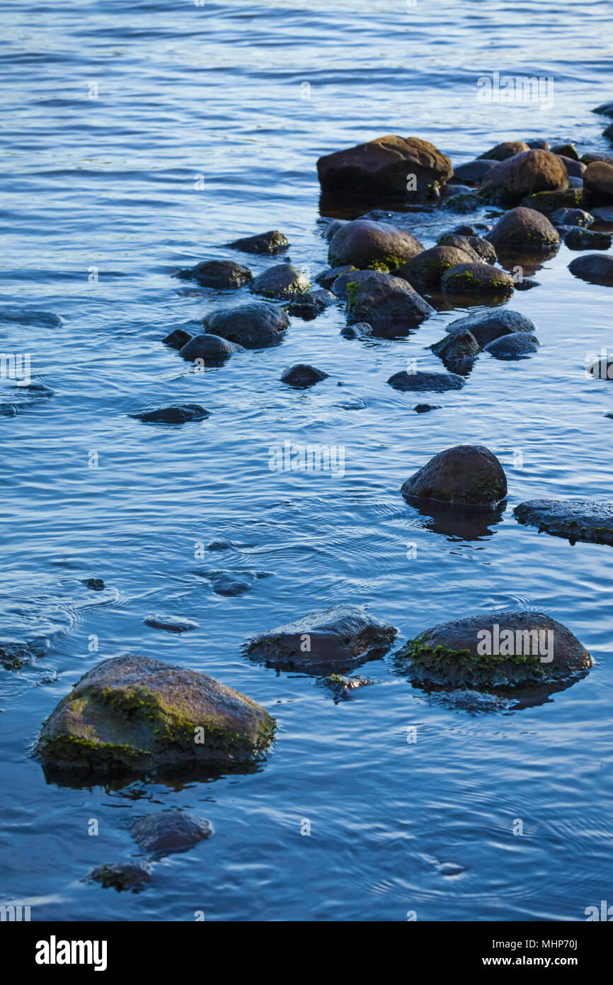 nature background, rounded rocks in water Stock Photo - Alamy
