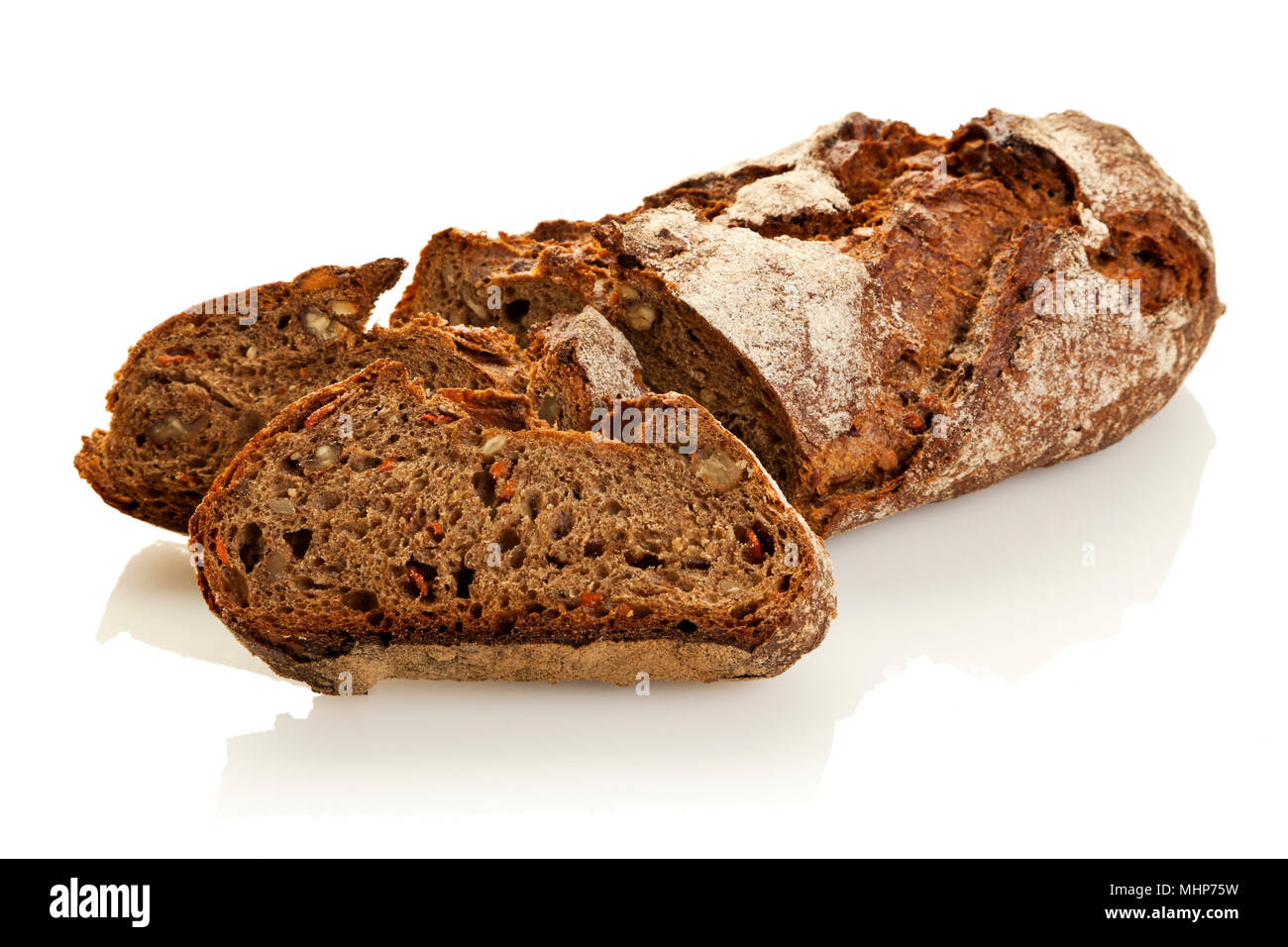 Half loaf and slices of rustic whole grain brown bread with nuts and ...