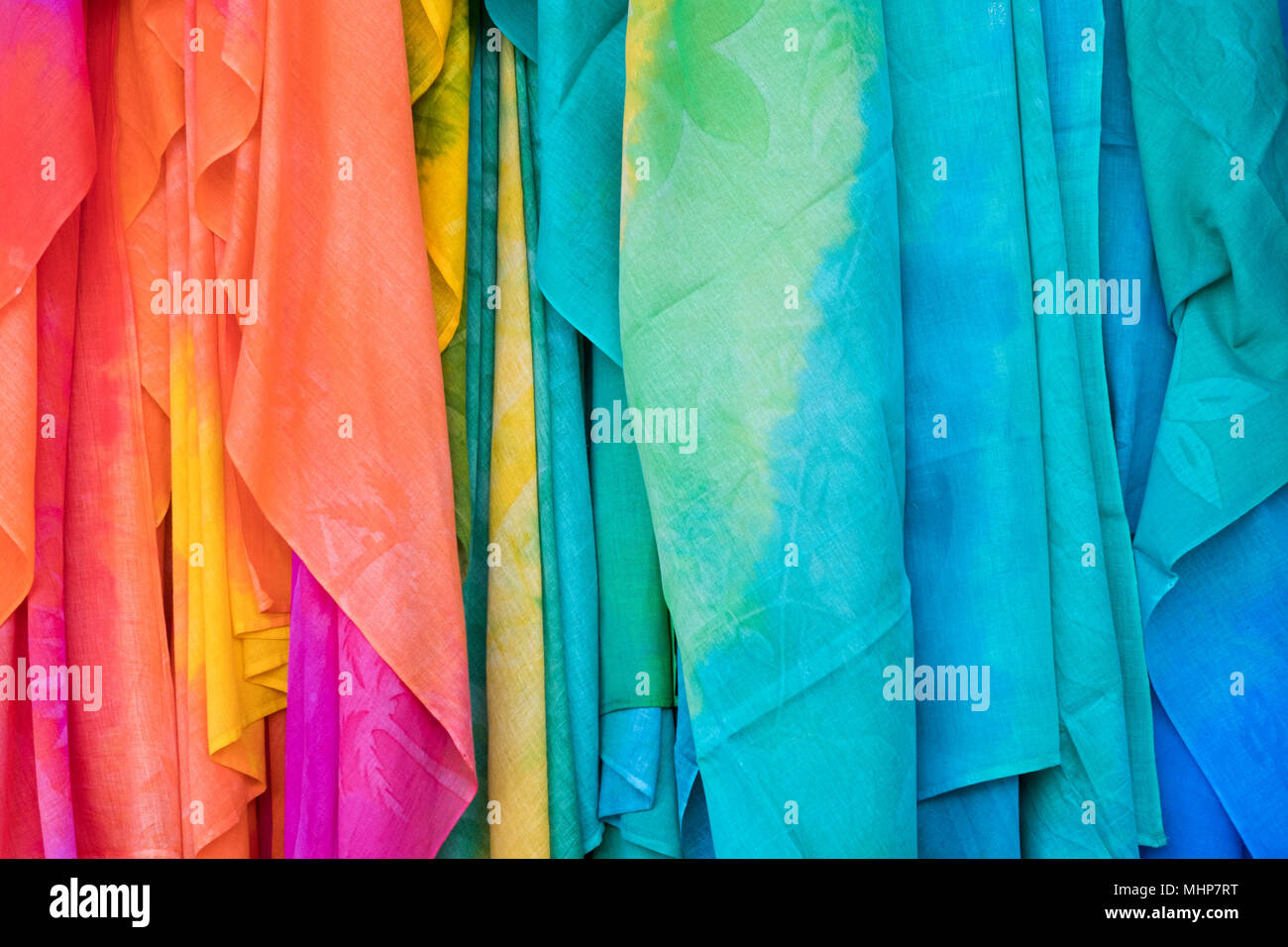 colorful pareo and polynesian dress for sale at the market Stock Photo ...