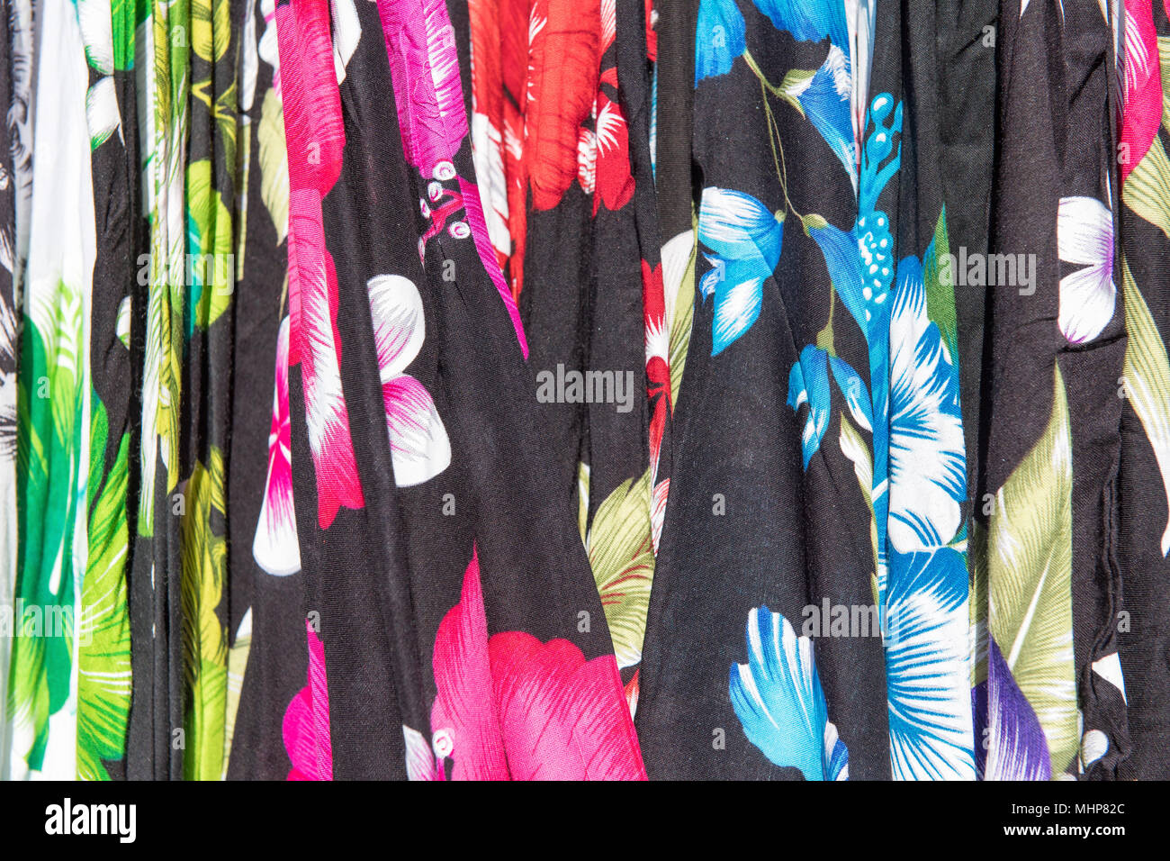 colorful pareo and polynesian dress for sale at the market Stock Photo ...