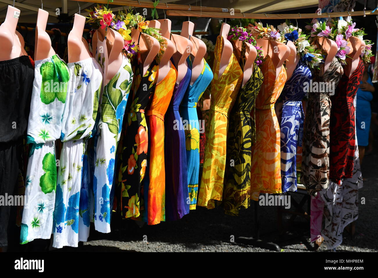 colorful pareo and polynesian dress for sale at the market Stock Photo ...
