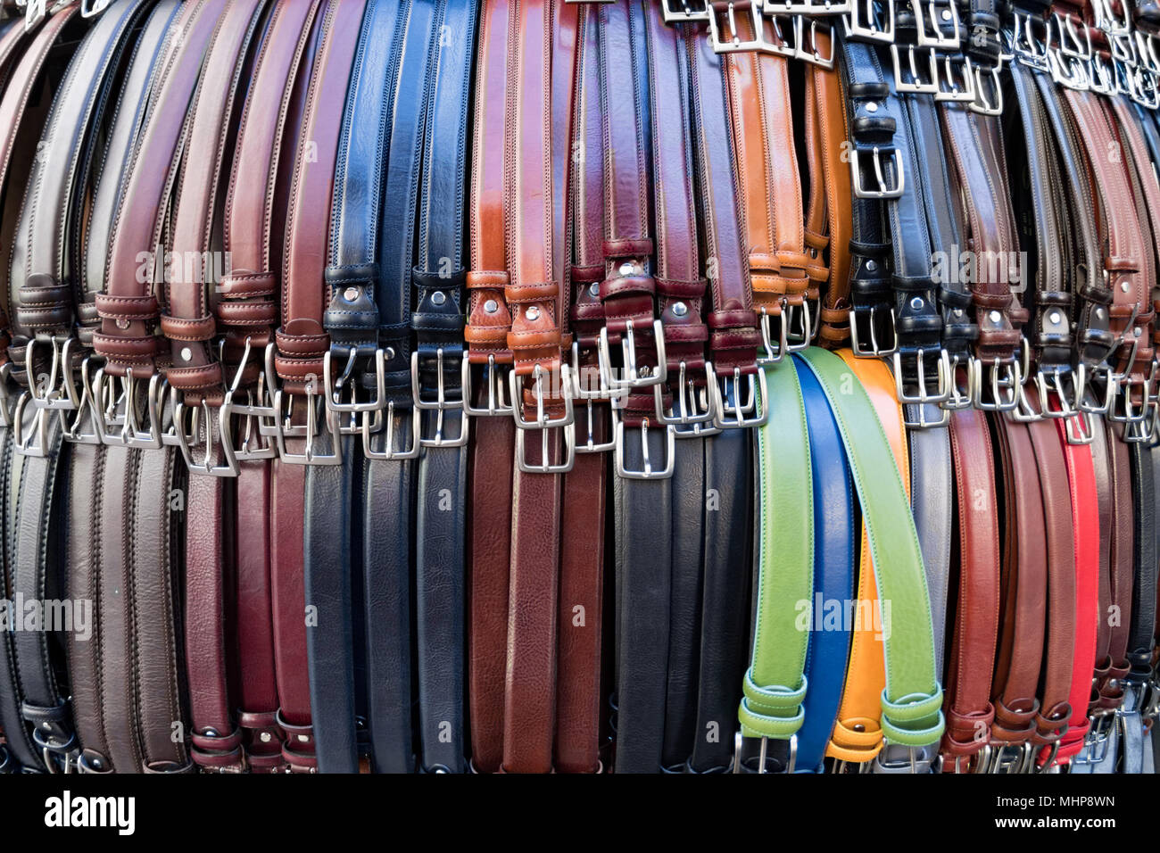 different colors leather belt on display Stock Photo - Alamy