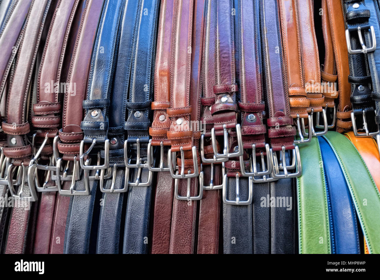 different colors leather belt on display Stock Photo - Alamy