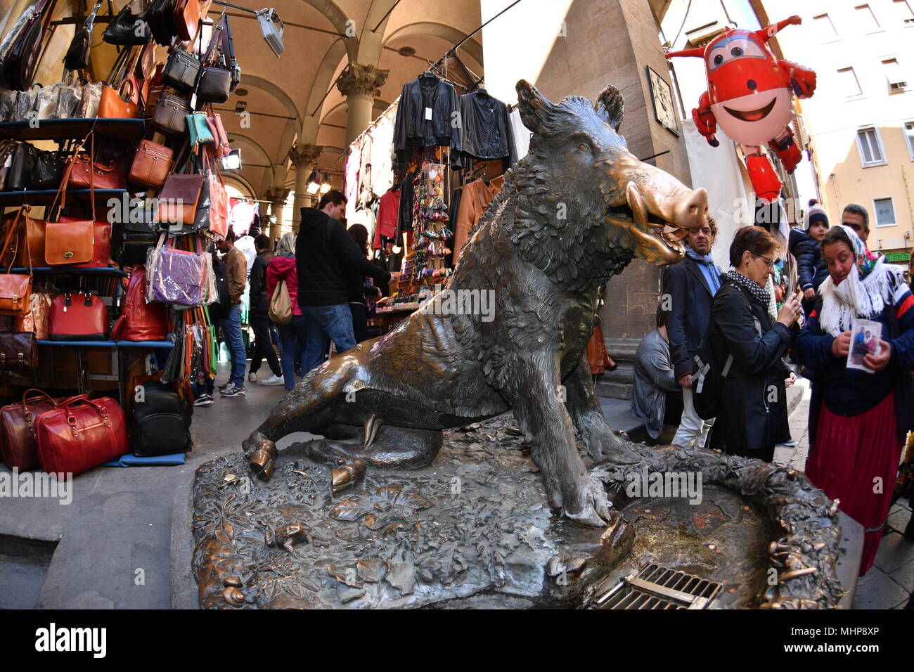 FLORENCE, ITALY - MARCH 27 2017 - Tourist touching fortune boar pig in ...