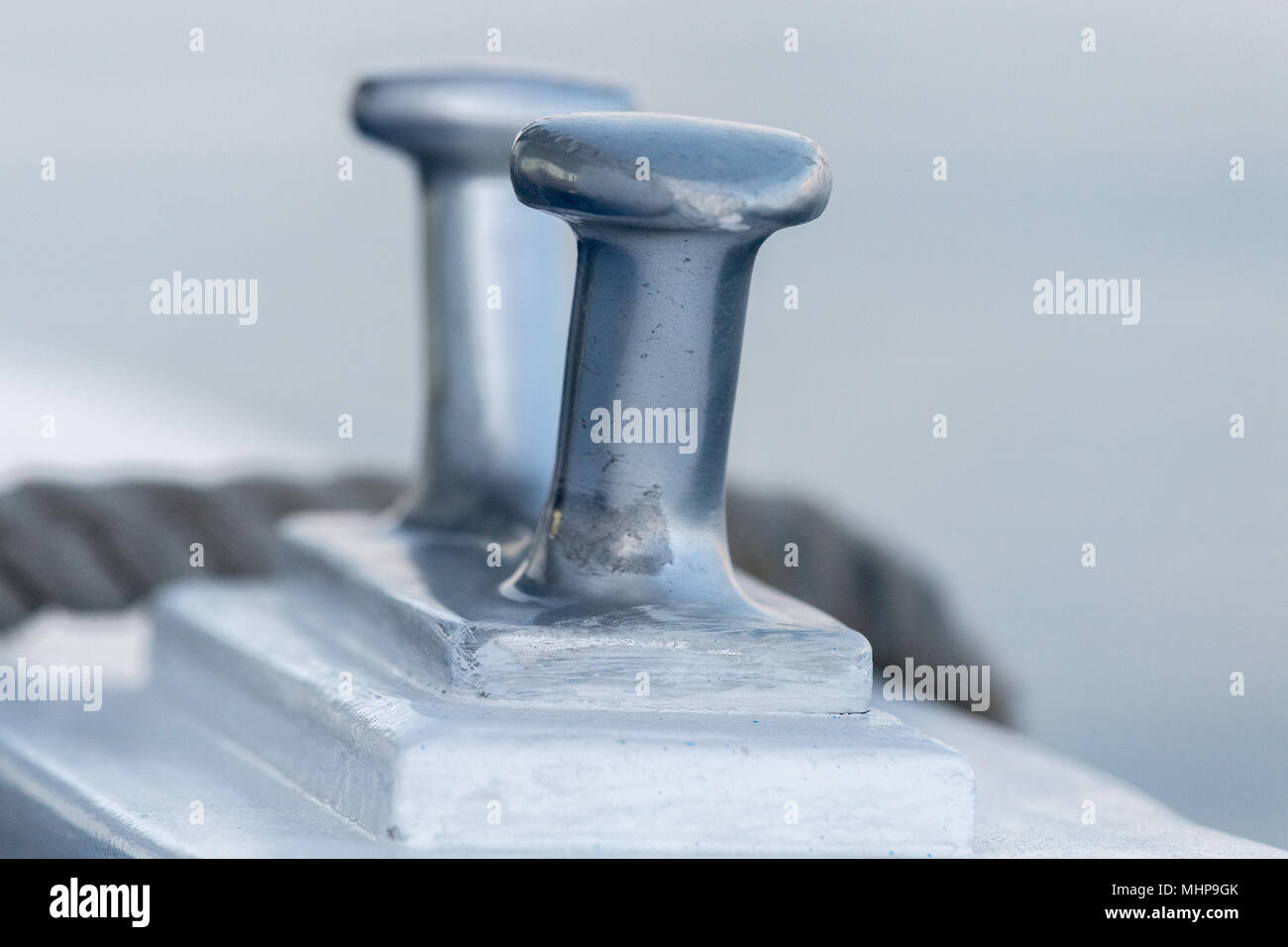 boat ship bollard detail on blue sea background Stock Photo - Alamy