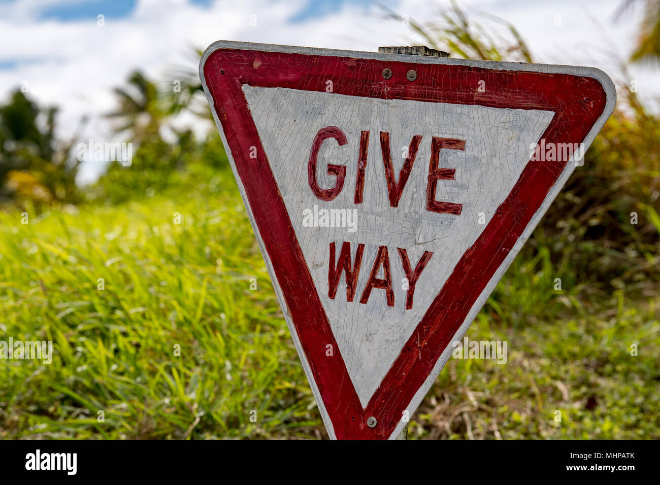 old wood give way road sign on grass Stock Photo - Alamy