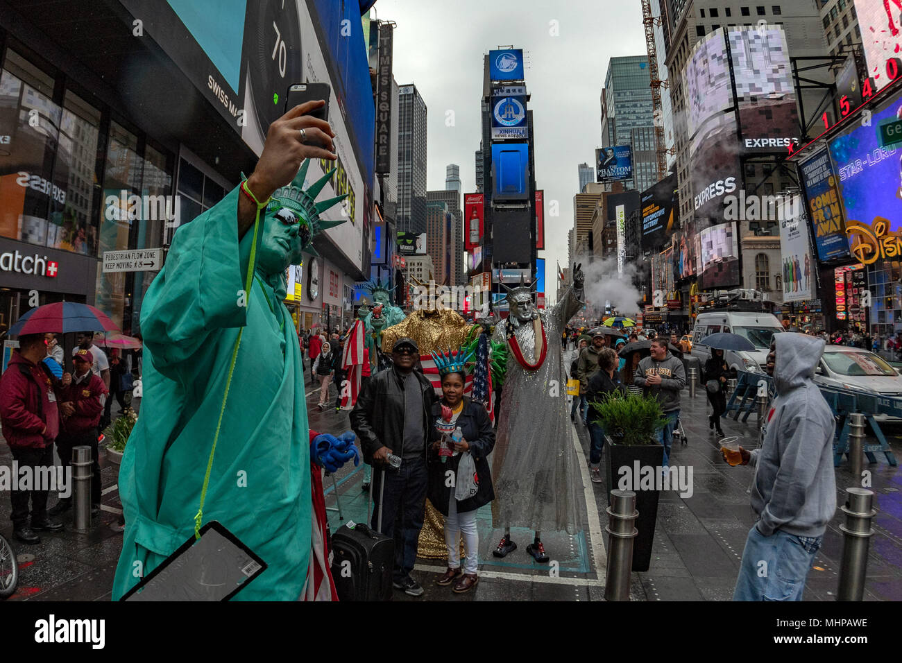 Human statue liberty times square hi-res stock photography and images ...